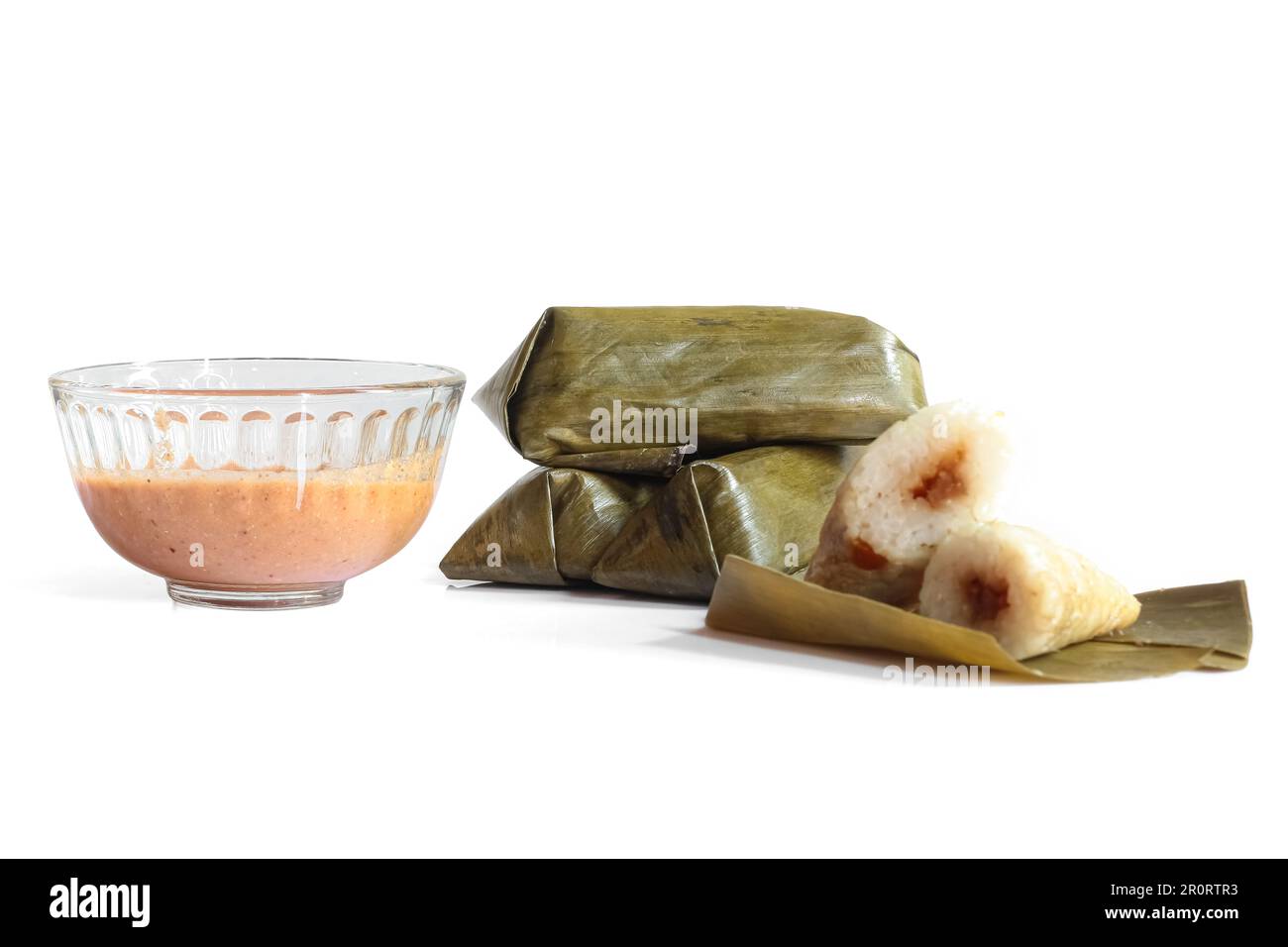 Lontong isolated on white background. Lontong is rice wrapped in banana ...