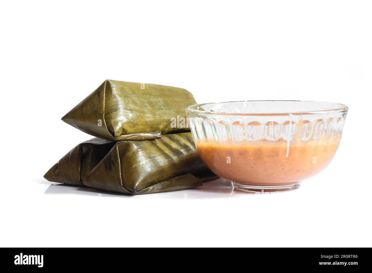 Lontong isolated on white background. Lontong is rice wrapped in banana ...