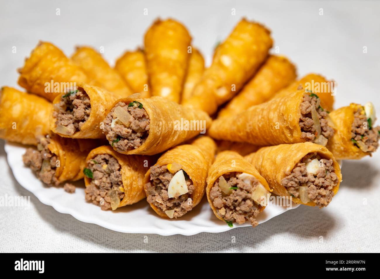 Traditional party snack known as "canudinho"or "tatu tail". Stuffed ...
