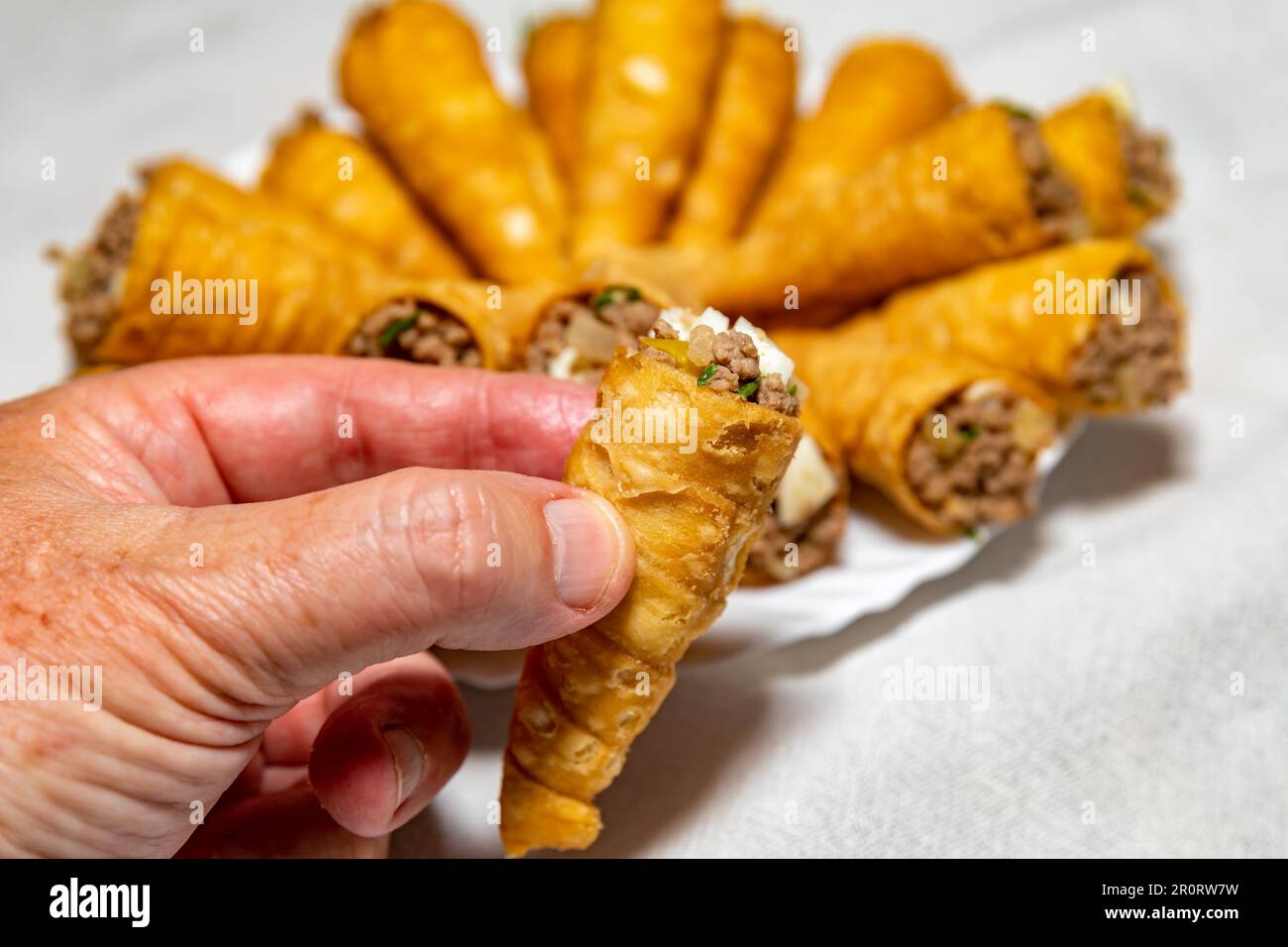 Traditional party snack known as "canudinho"or "tatu tail". Stuffed ...