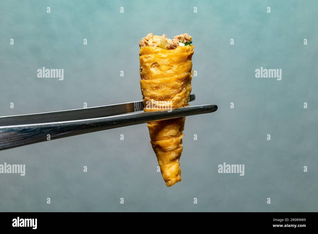 Traditional party snack known as "canudinho"or "tatu tail". Stuffed ...