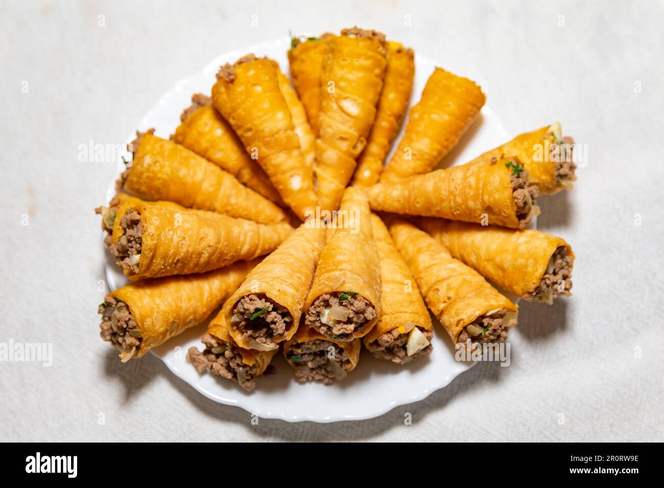 Traditional party snack known as "canudinho"or "tatu tail". Stuffed ...