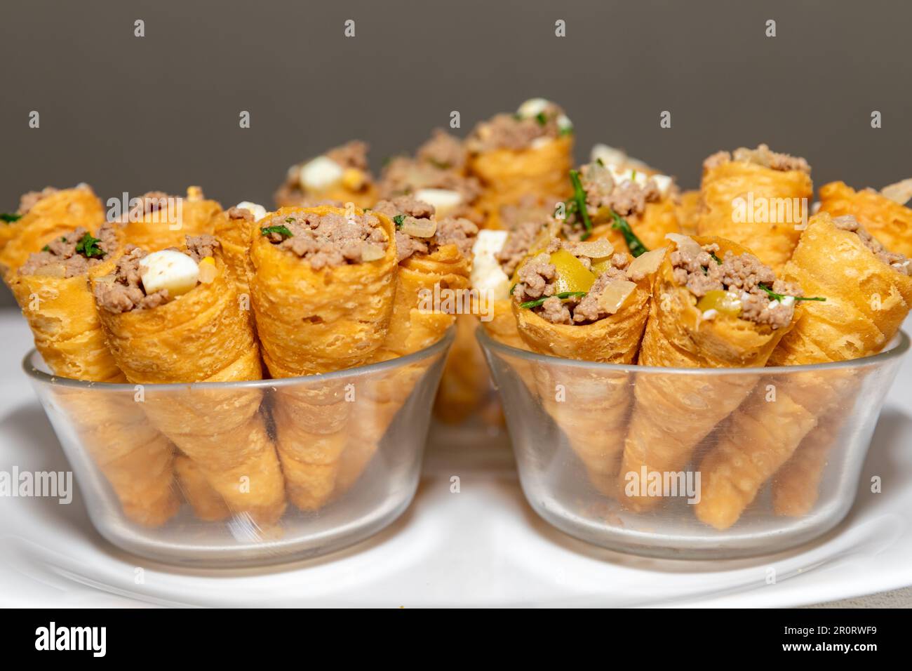 Traditional party snack known as "canudinho"or "tatu tail". Stuffed ...