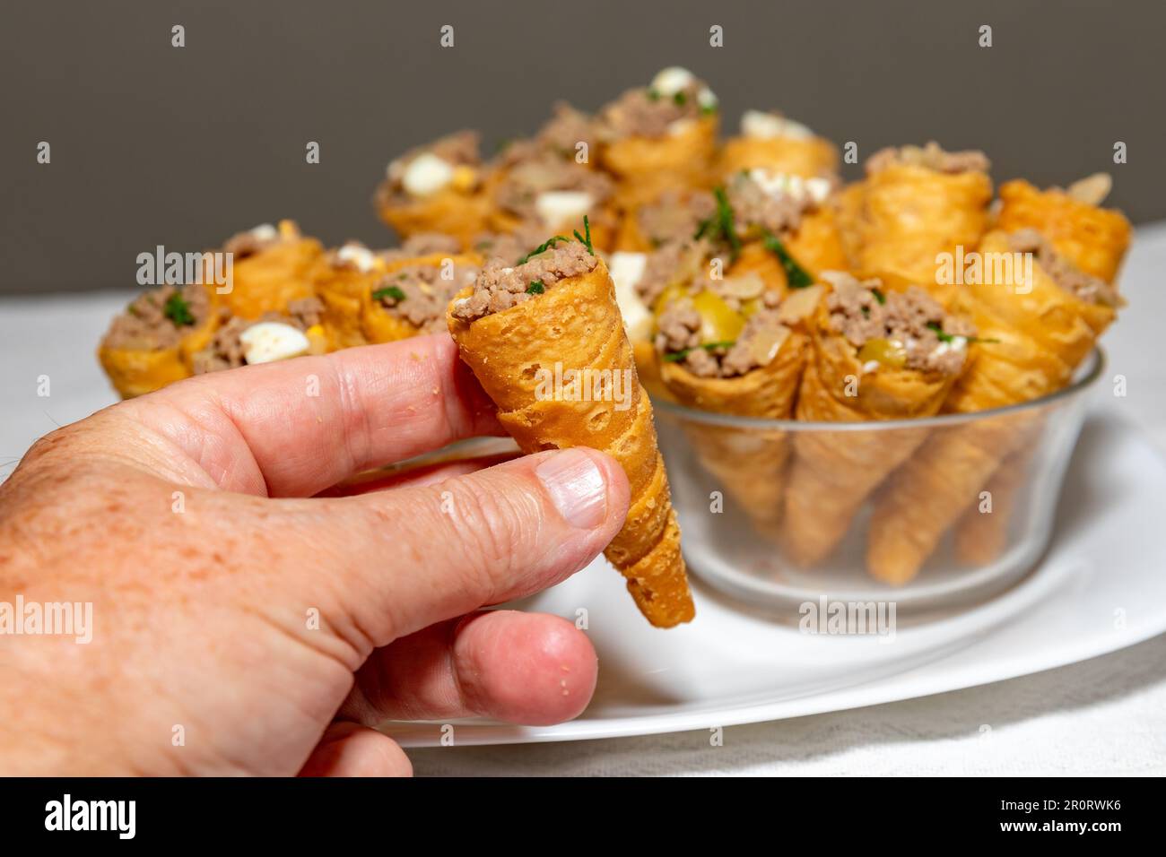 Traditional party snack known as "canudinho"or "tatu tail". Stuffed ...