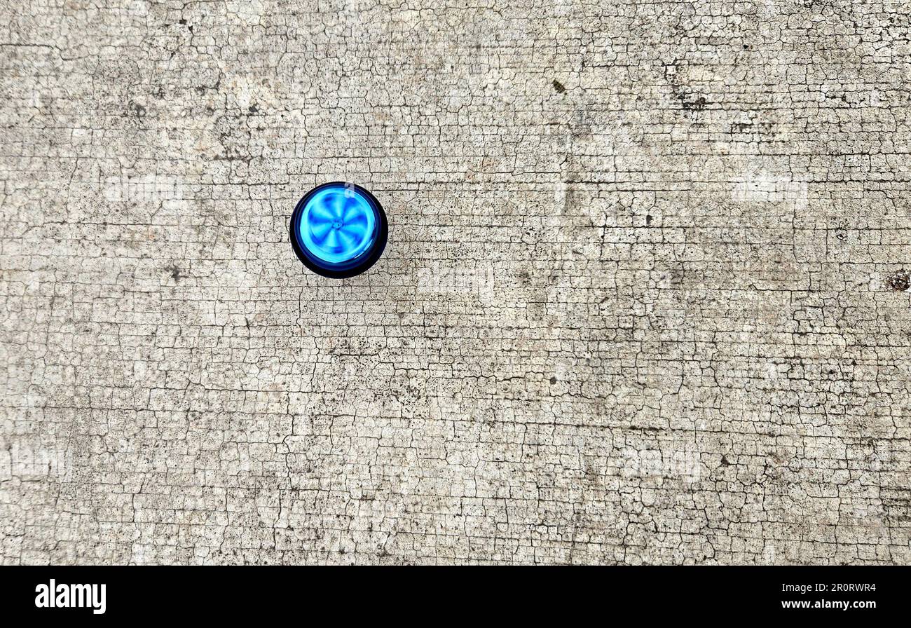 Blue spinning top, toy for children and adults, a type of spinning top ...