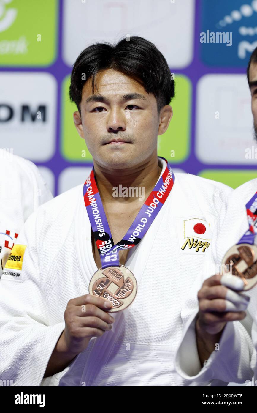 Japan's Soichi Hashimoto poses after winning bronze in the men's 73 ...