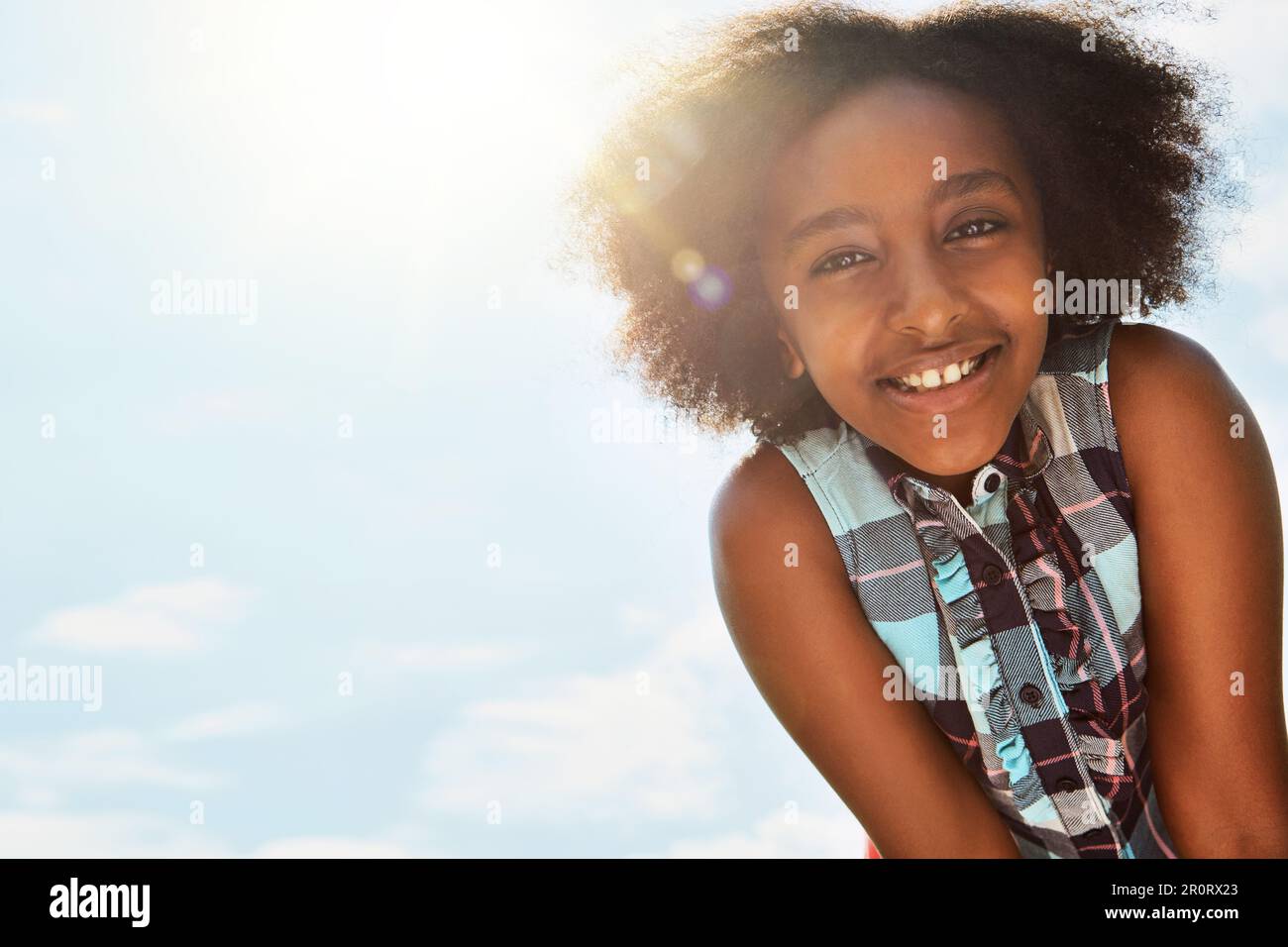 Happy summer days are here. Portrait of a happy girl standing outside ...