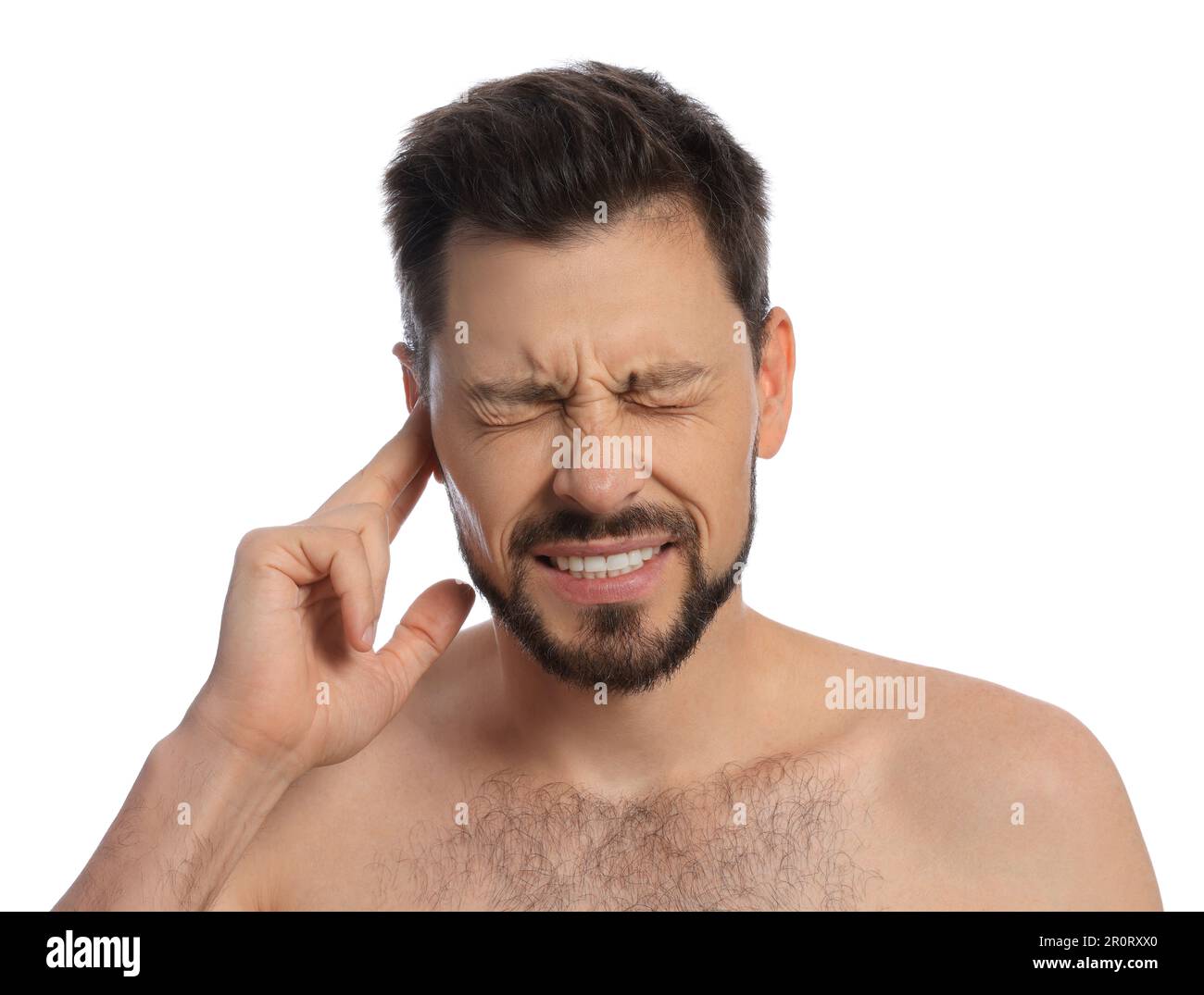 Man suffering from ear pain on white background Stock Photo - Alamy