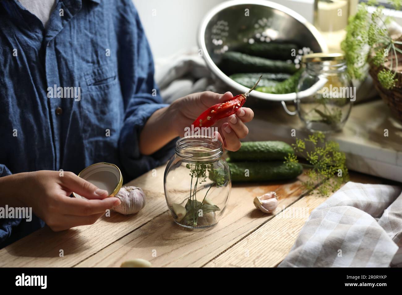 Woman putting dill jar hi-res stock photography and images - Alamy