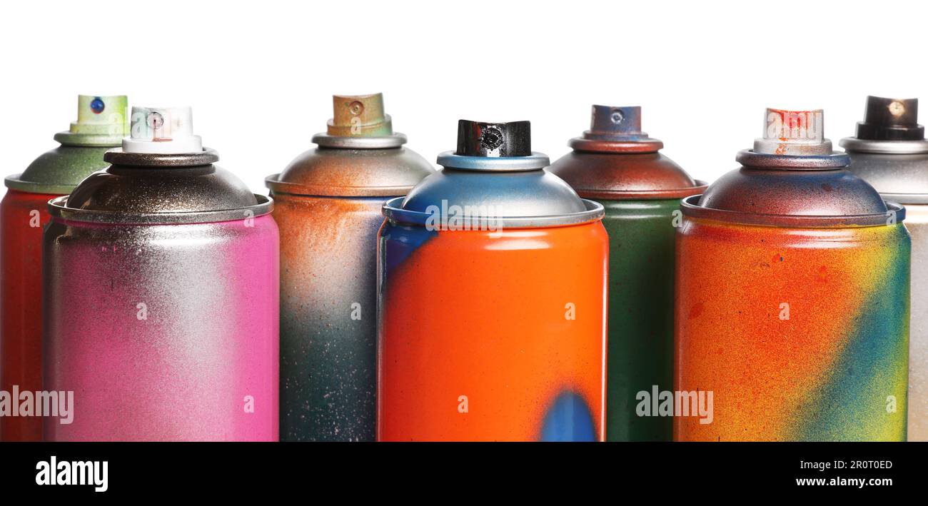 Used cans of spray paints on white background Stock Photo - Alamy