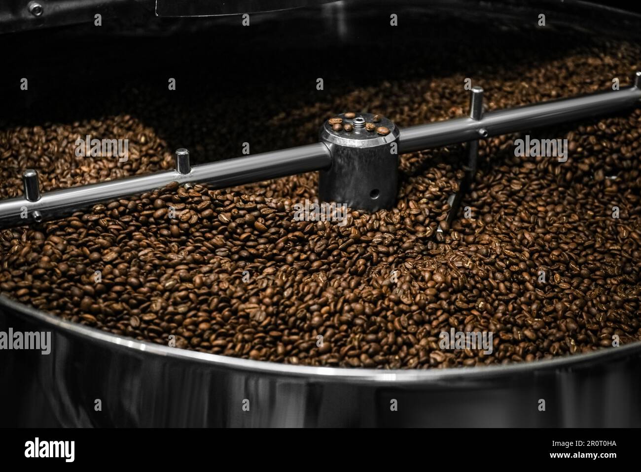 Modern coffee roaster machine with beans, closeup Stock Photo - Alamy