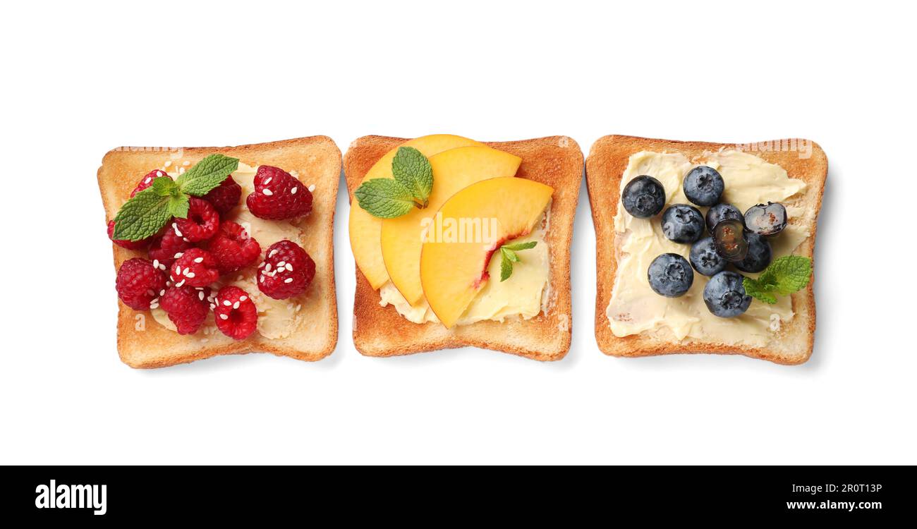 Tasty toasts with different spreads and fruits on white background, top ...