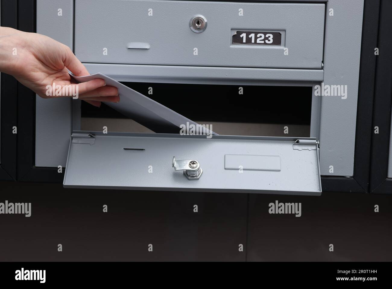 Woman taking mail from mailbox hi-res stock photography and images - Alamy