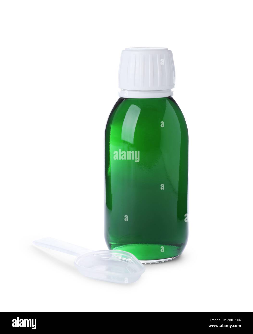 Bottle of syrup with plastic spoon on white background. Cough and cold ...