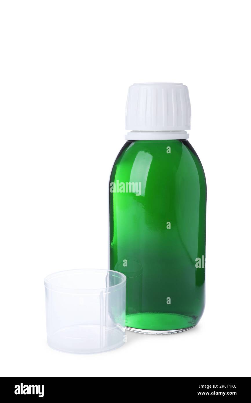 Bottle of syrup with measuring cup on white background. Cough and cold ...