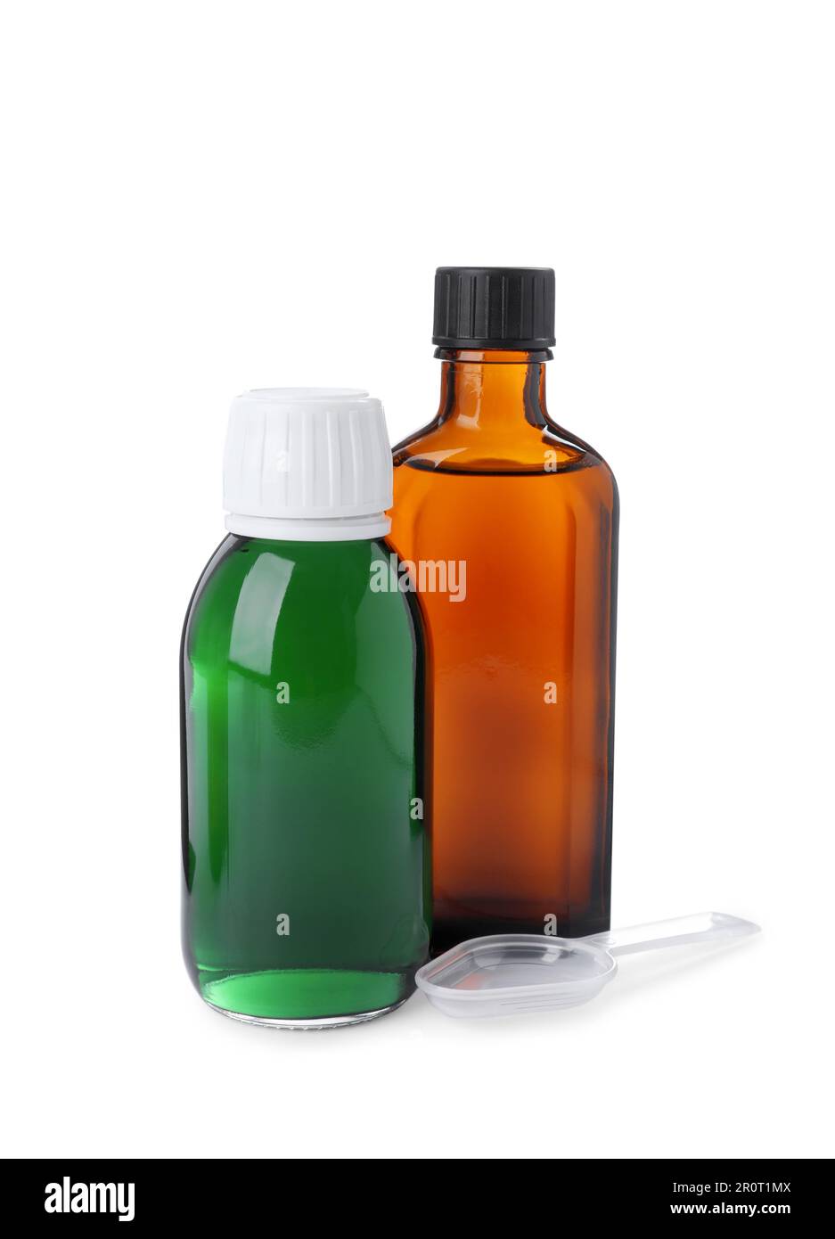 Bottles of syrups with plastic spoon on white background. Cough and ...