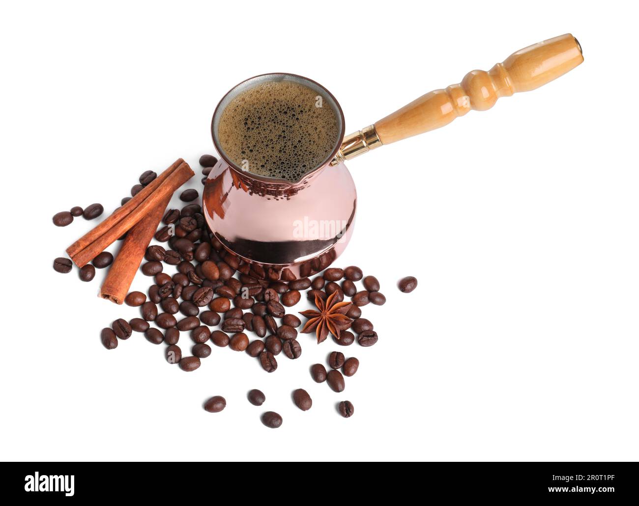 Turkish coffee. Cezve with hot coffee and spices on white background ...