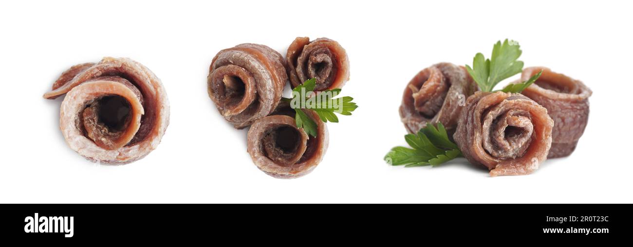 Set with delicious rolled anchovy fillets on white background. Banner ...