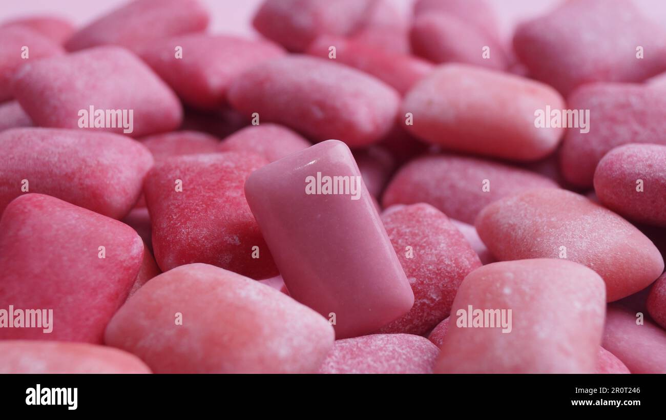 Many pink chewing gums as background, closeup Stock Photo - Alamy