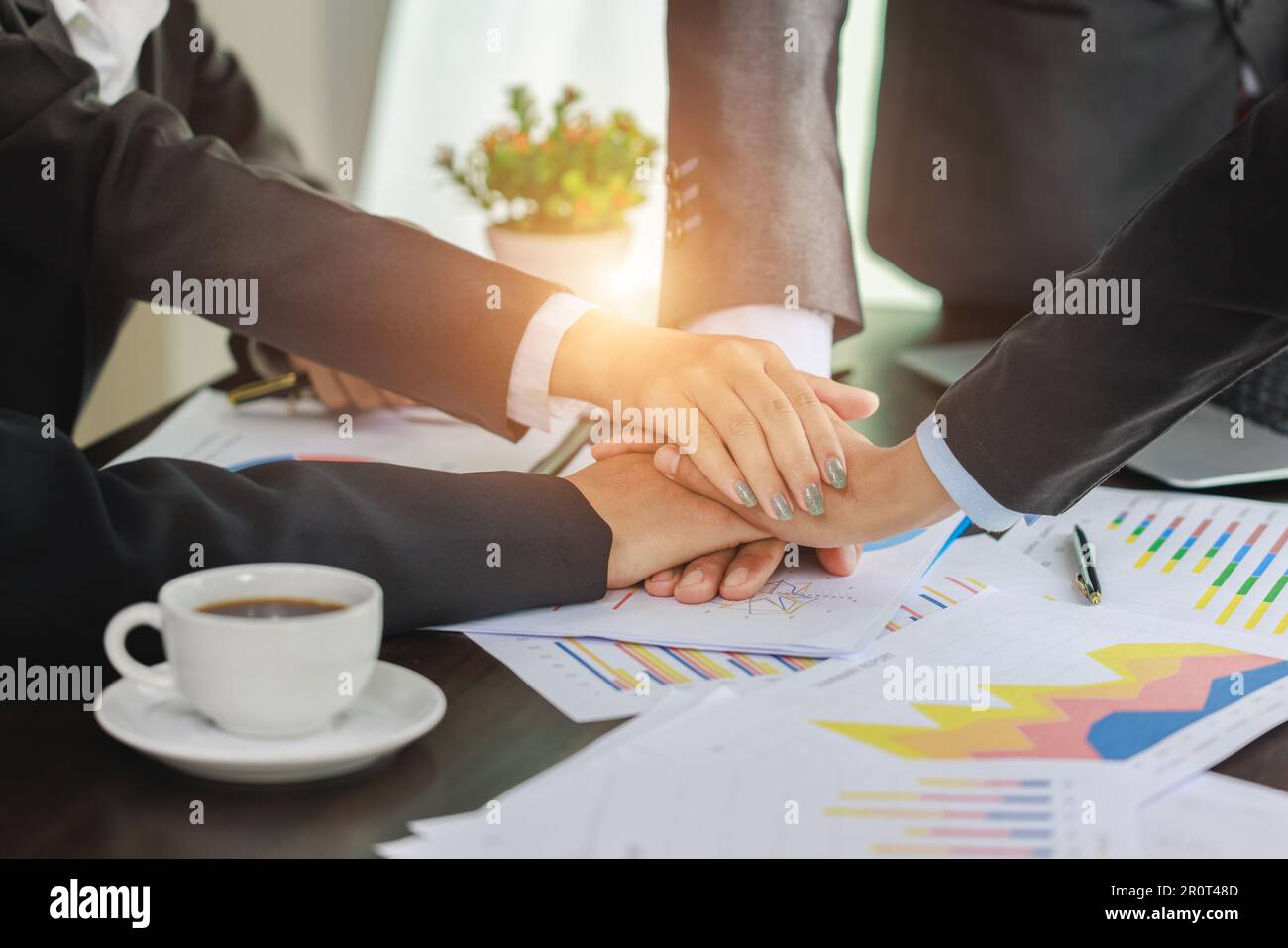 Business people put their hands together unity and teamwork concept Job ...
