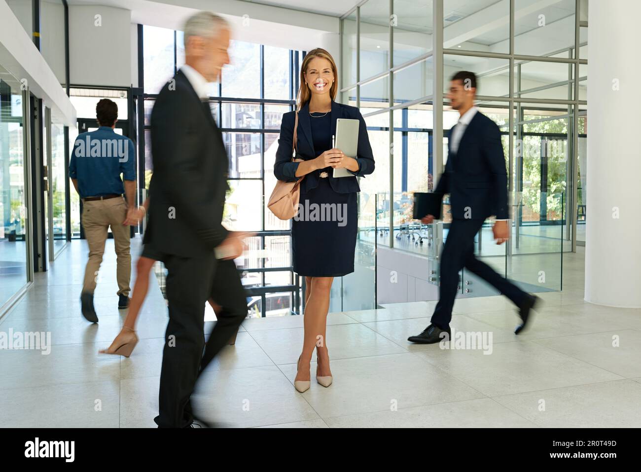 Standing tall and proud at work. Full length shot of an attractive ...