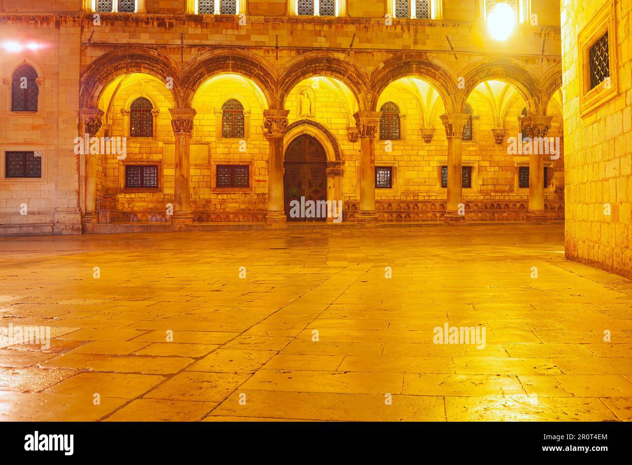 Gothic palace with arches illuminated in night . Rector's Palace in ...