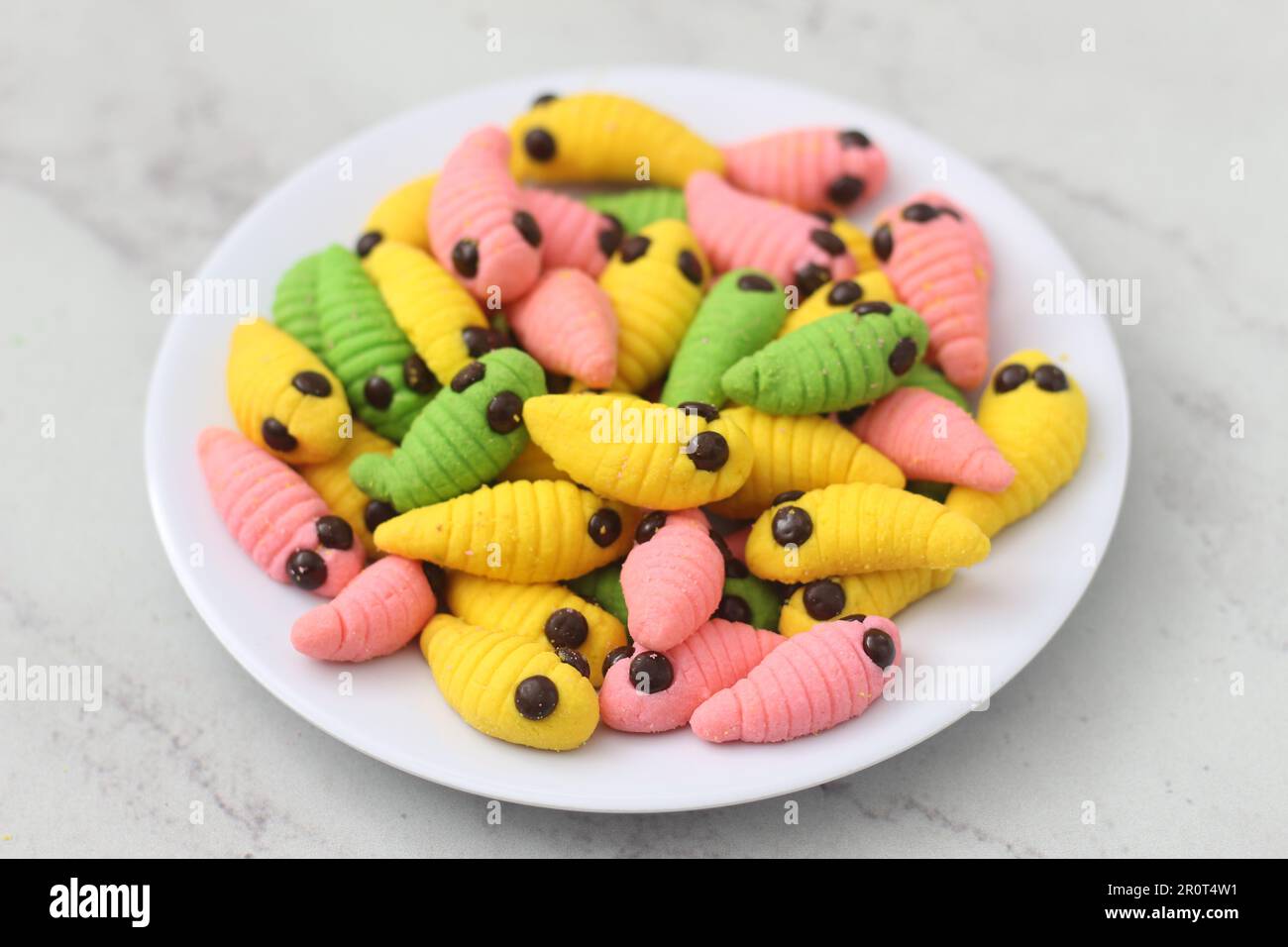 caterpillar cake with various colors. presented during Hari Raya or Eid ...