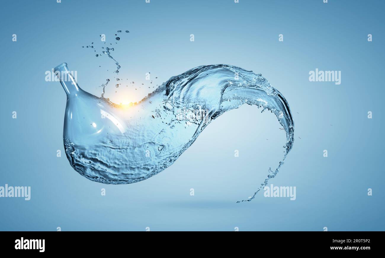 Water splash out of glass bottle Stock Photo - Alamy