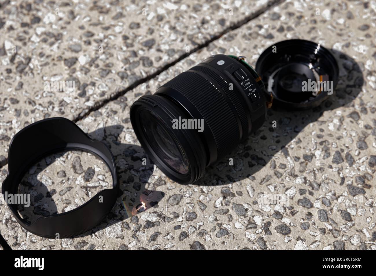 A broken lens on the street sunny day handheld Stock Photo - Alamy