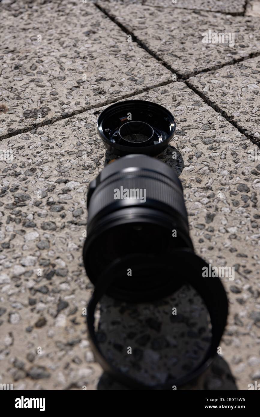 A broken lens on the street sunny day handheld Stock Photo - Alamy