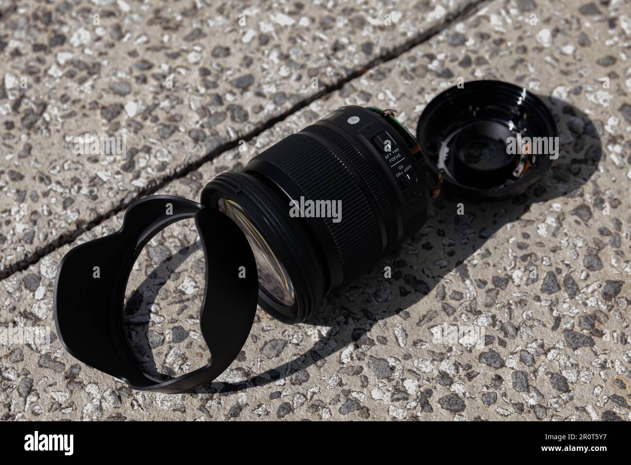 A broken lens on the street sunny day handheld Stock Photo - Alamy