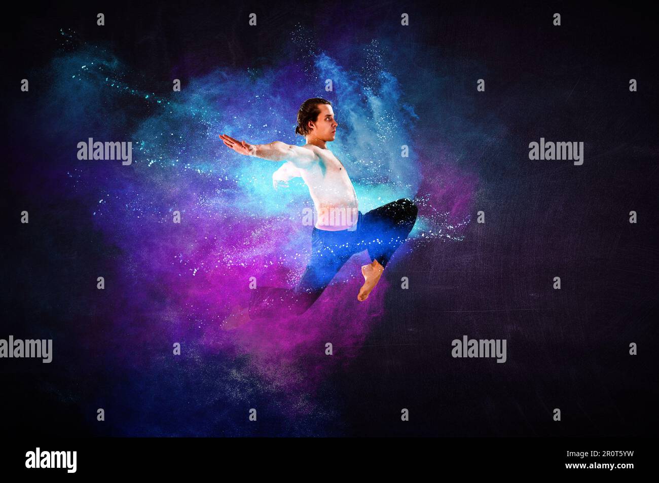 Male dancer against abstract colourful background Stock Photo - Alamy