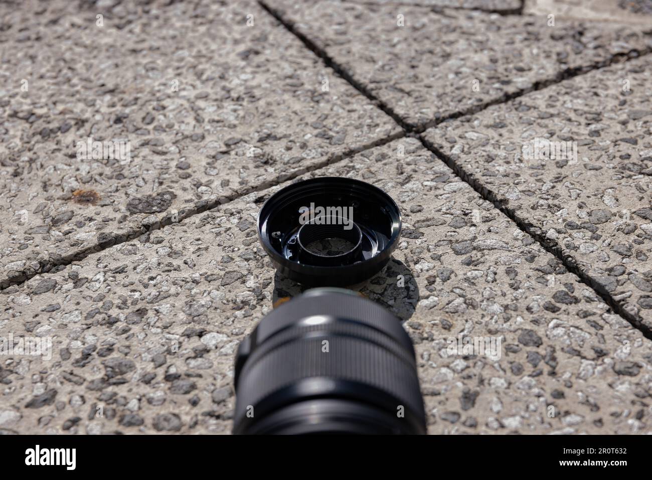 A broken lens on the street sunny day handheld Stock Photo - Alamy