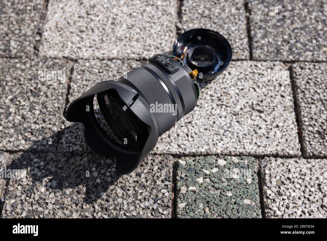 A broken lens on the street sunny day handheld Stock Photo - Alamy