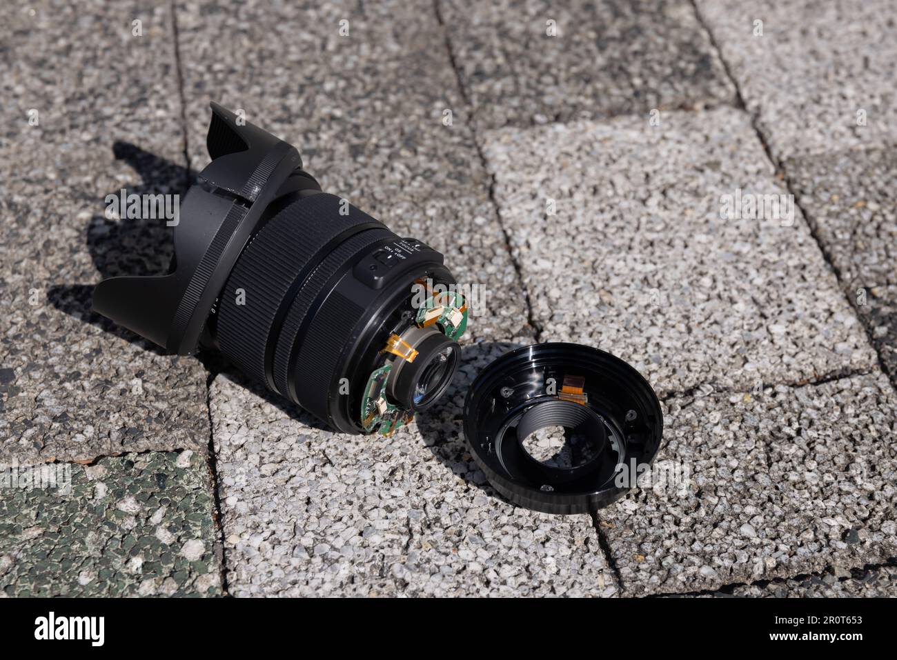 A broken lens on the street sunny day handheld Stock Photo - Alamy