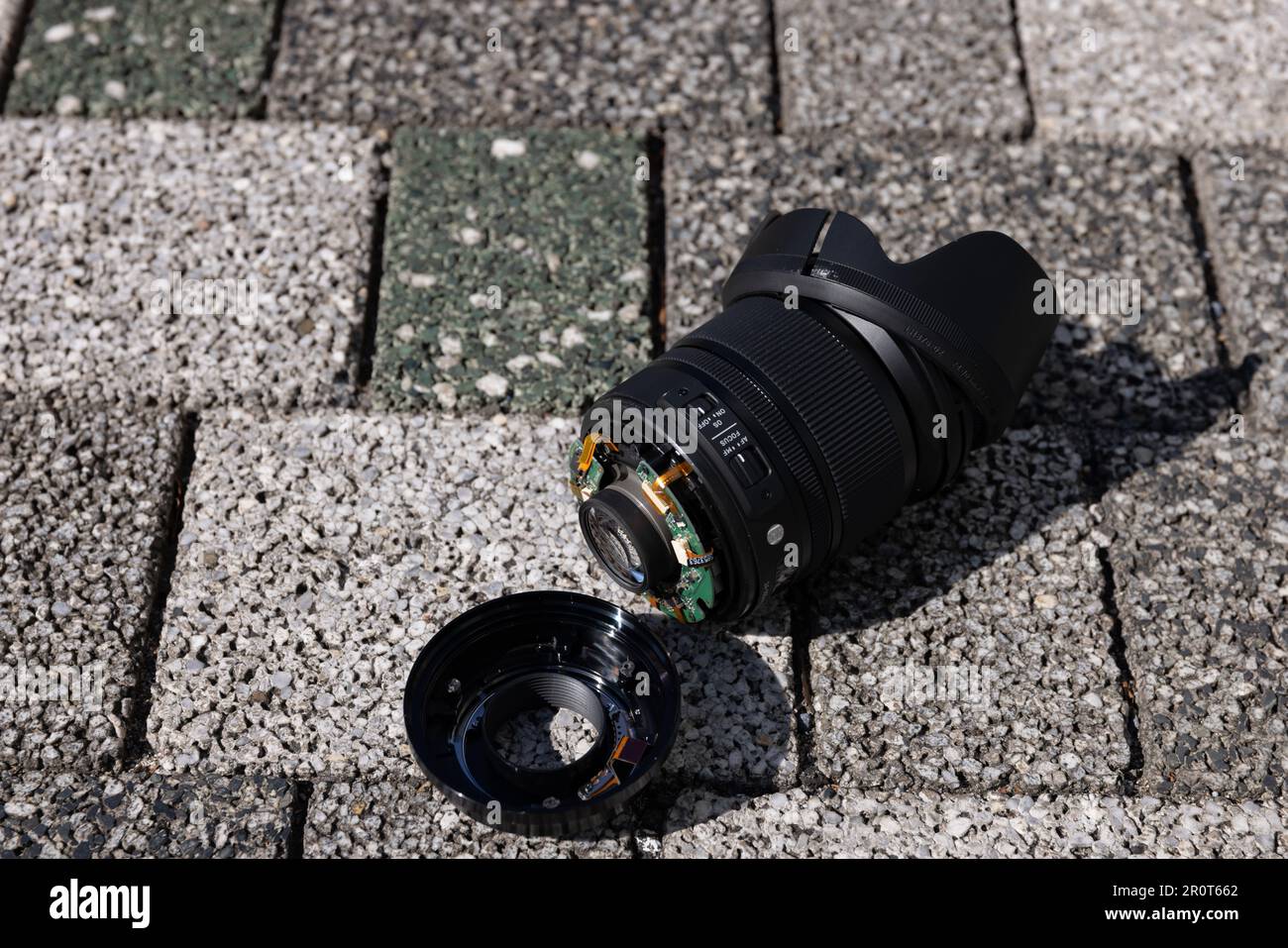A broken lens on the street sunny day handheld Stock Photo - Alamy