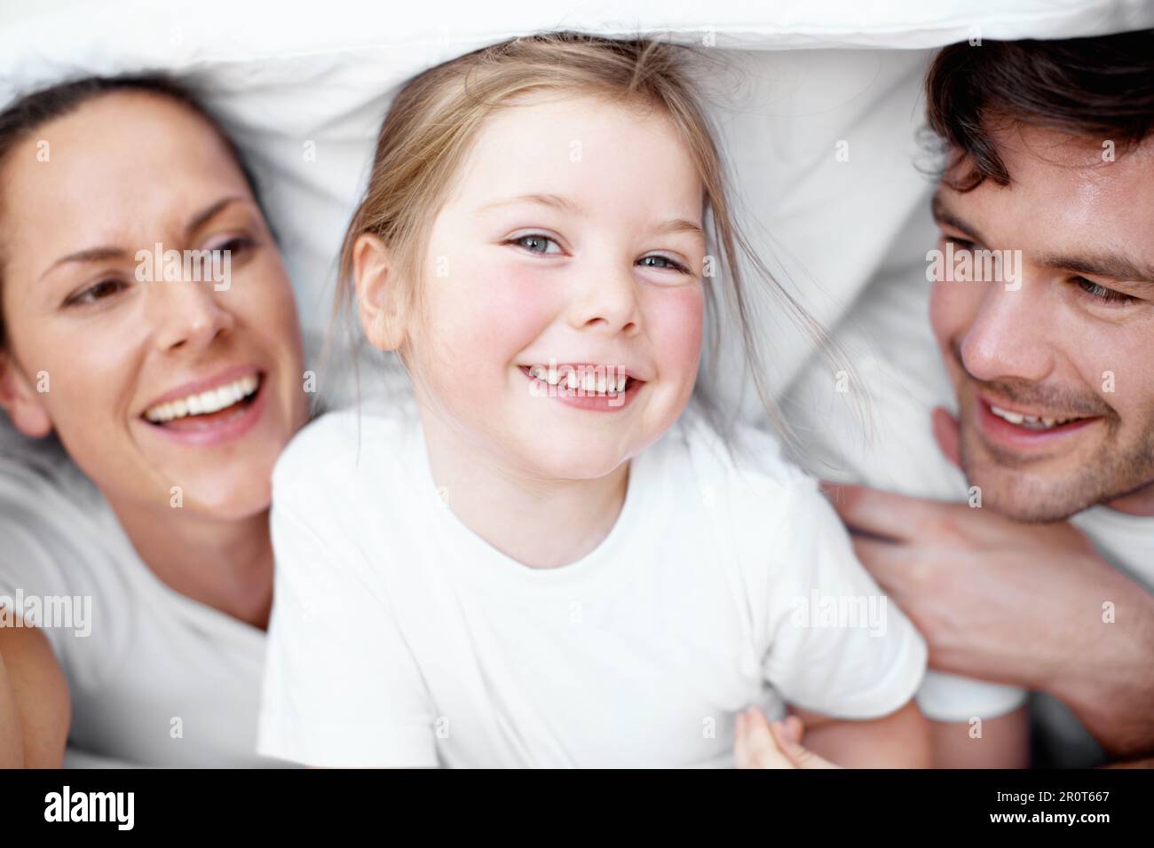 Me and my mom and dad. A young girl enjoying time with her mother and ...