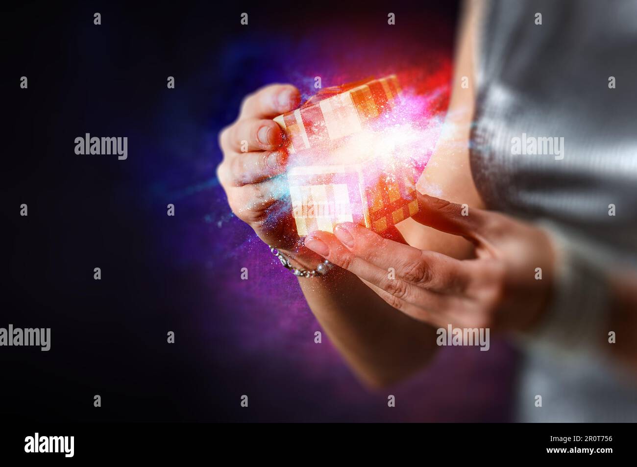 Closeup hands giving surprise gift box Stock Photo - Alamy