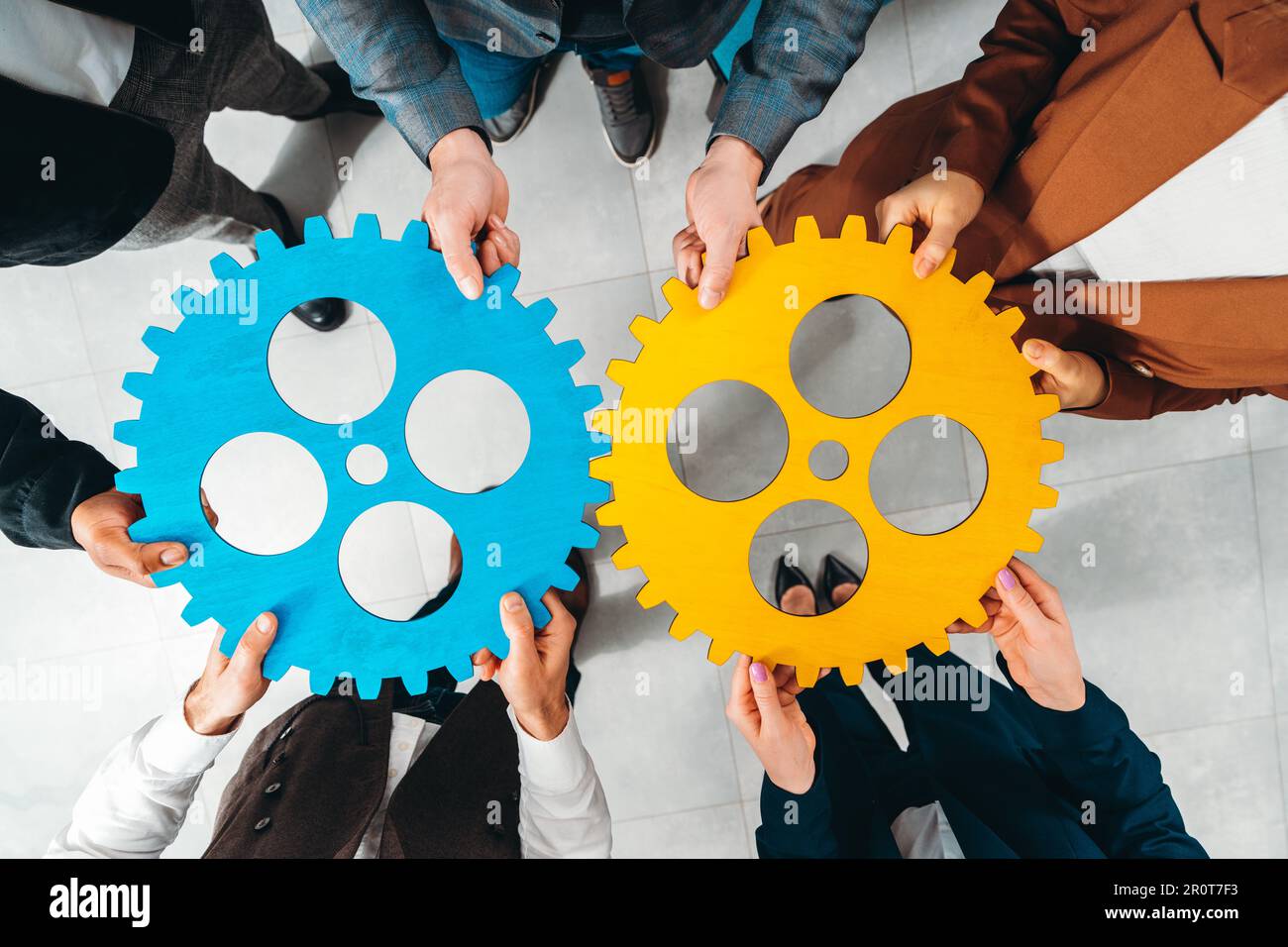 Business team work together and combine pieces of gears. Partnership ...