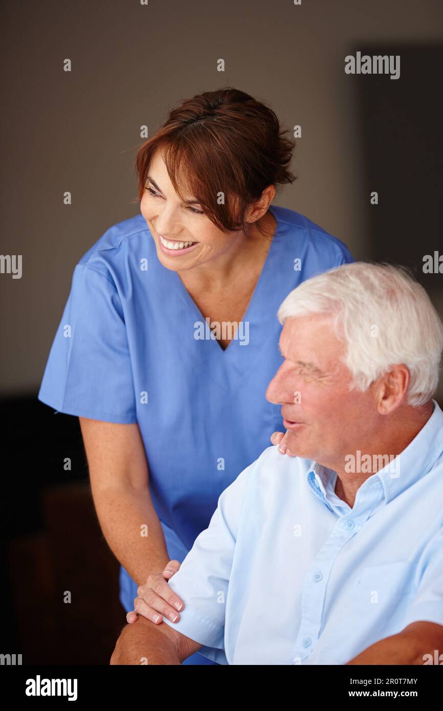 She cares about her patients wellbeing. a female nurse standing beside ...