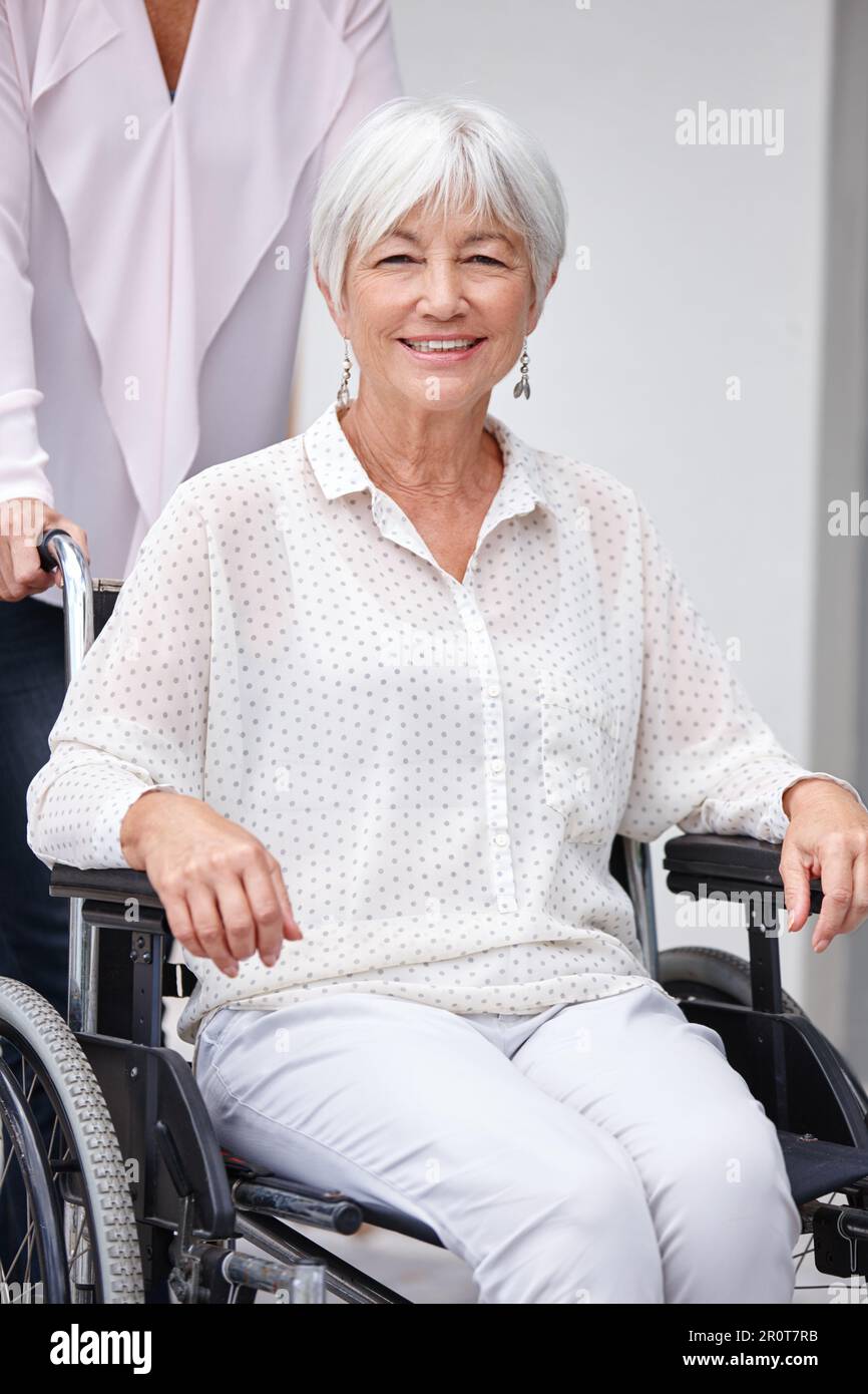 Getting all the support I need. a senior woman being pushed in a ...