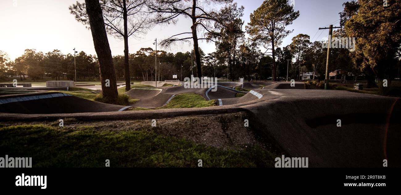 Skate park/pump track in early morning lighting Stock Photo - Alamy