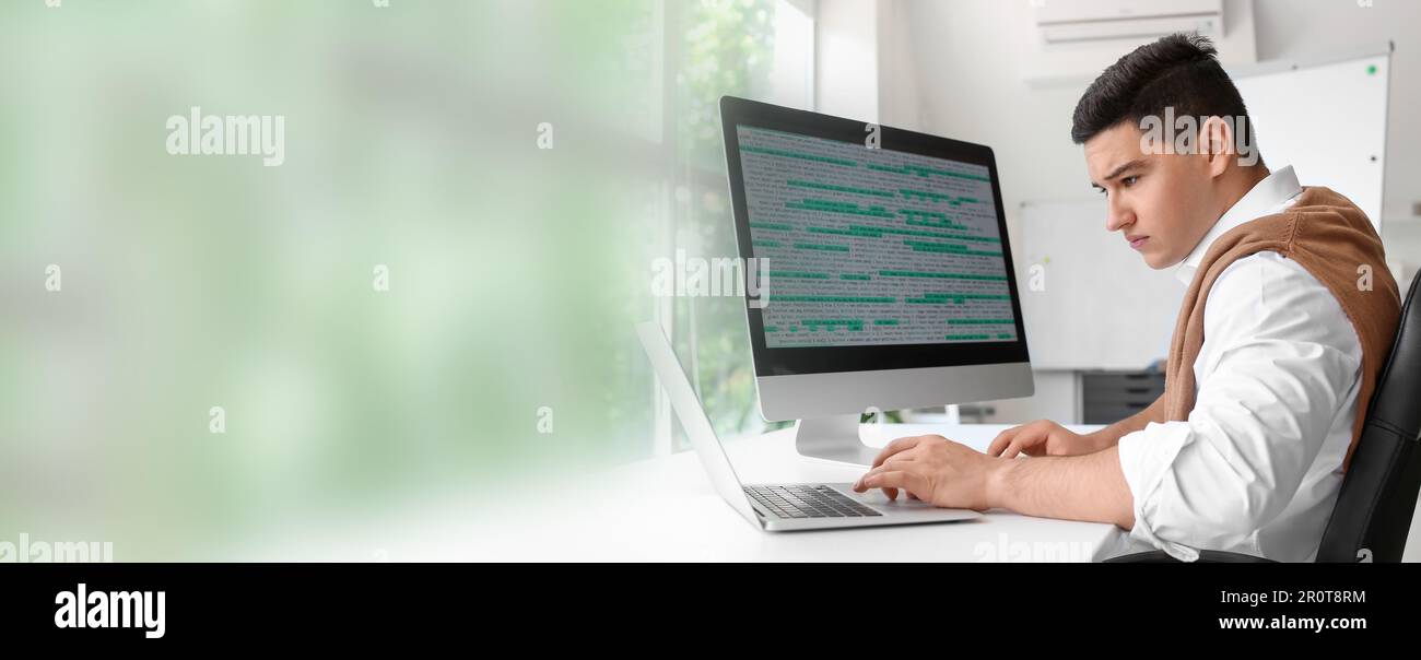 Male programmer working in office. Banner for design Stock Photo - Alamy