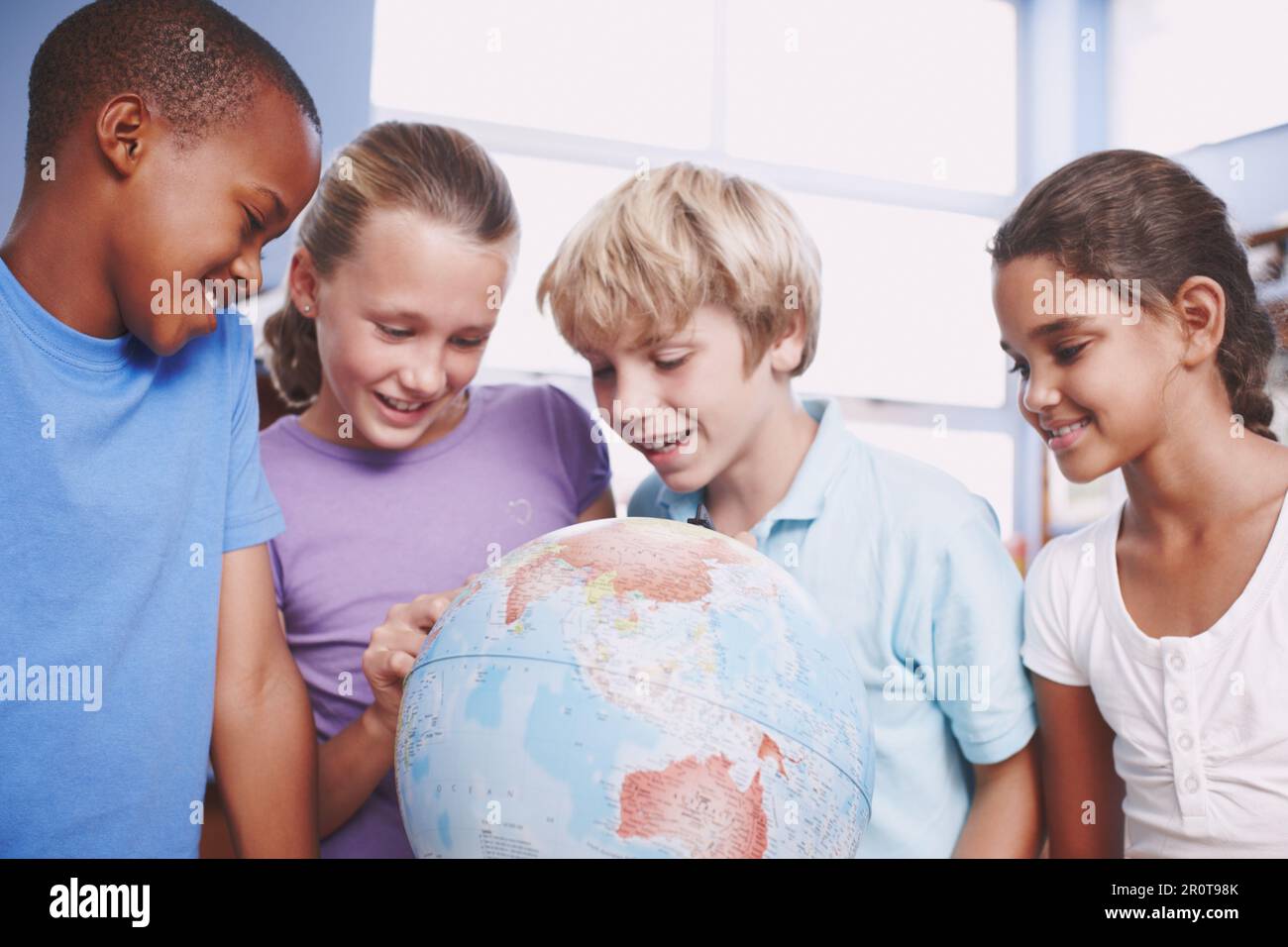 What a wonderful world. A group of schoolkids learning about the world ...