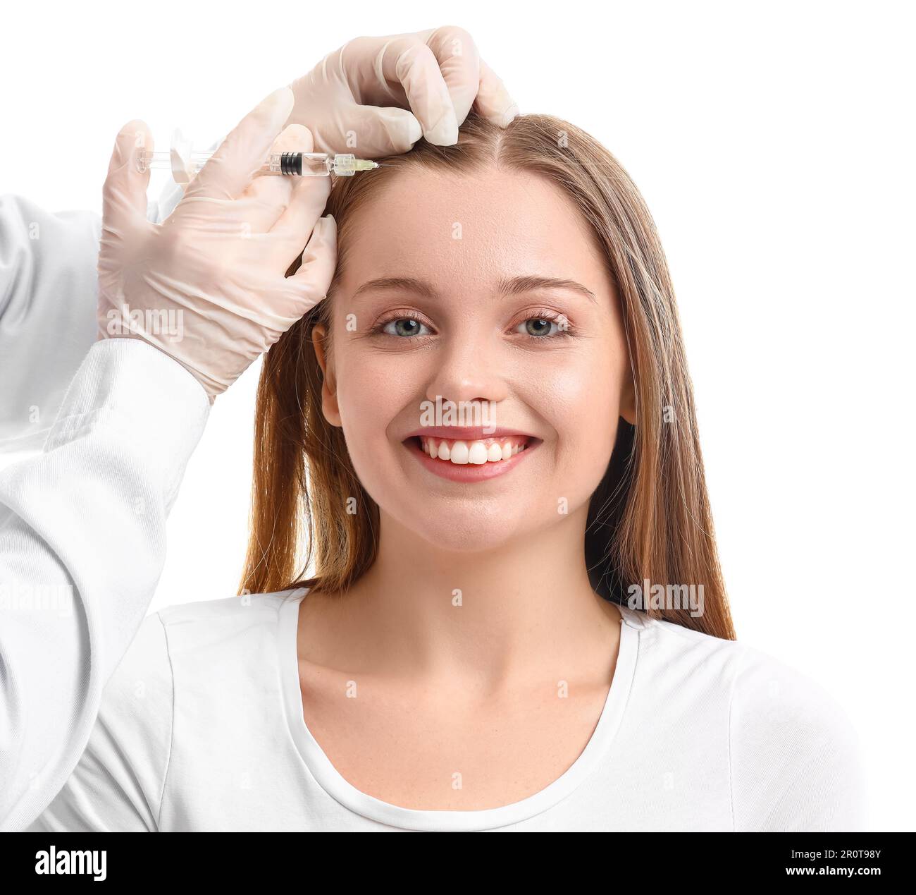 Woman with hair loss problem receiving injection on white background ...