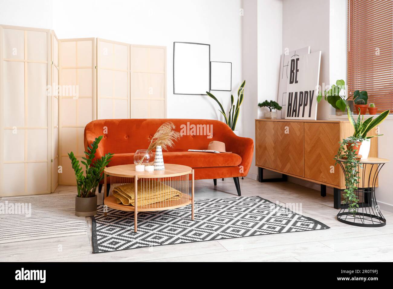 Interior of light living room with coffee table and sofa Stock Photo ...