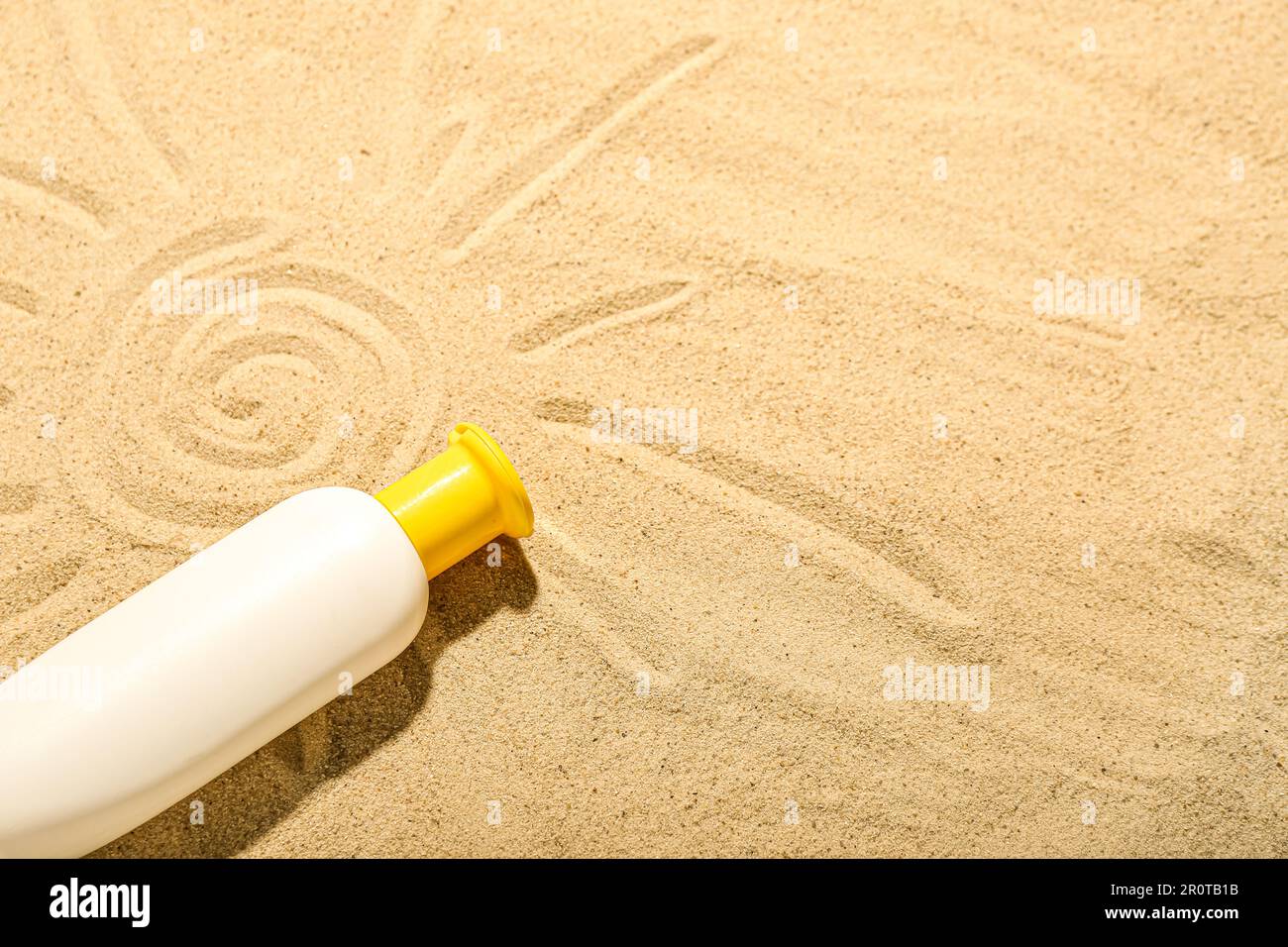 Creative composition with bottle of sunscreen cream with drawings on ...