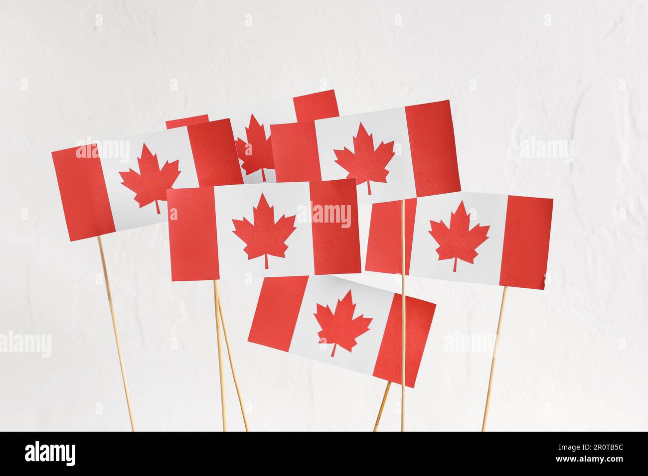 Paper flags of Canada on white background Stock Photo - Alamy