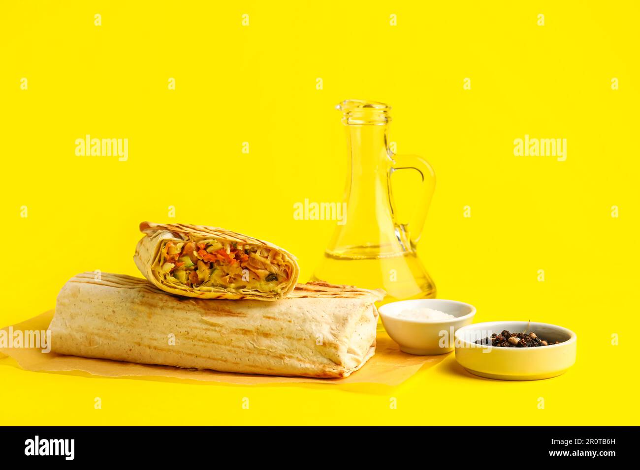 Baking paper with tasty shawarma on yellow background Stock Photo - Alamy