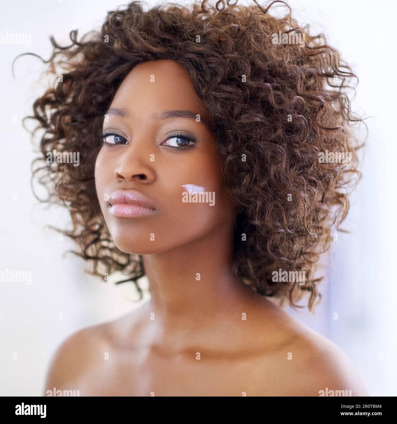 My secret to beautiful skin. a beautiful young woman during her daily ...